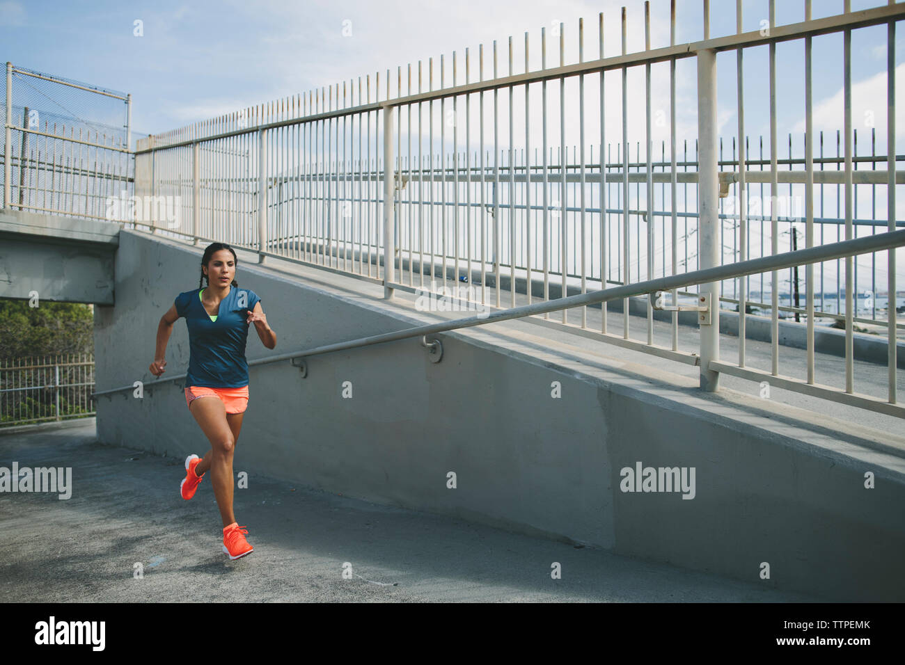 Woman young running sky fitness hi-res stock photography and images - Alamy