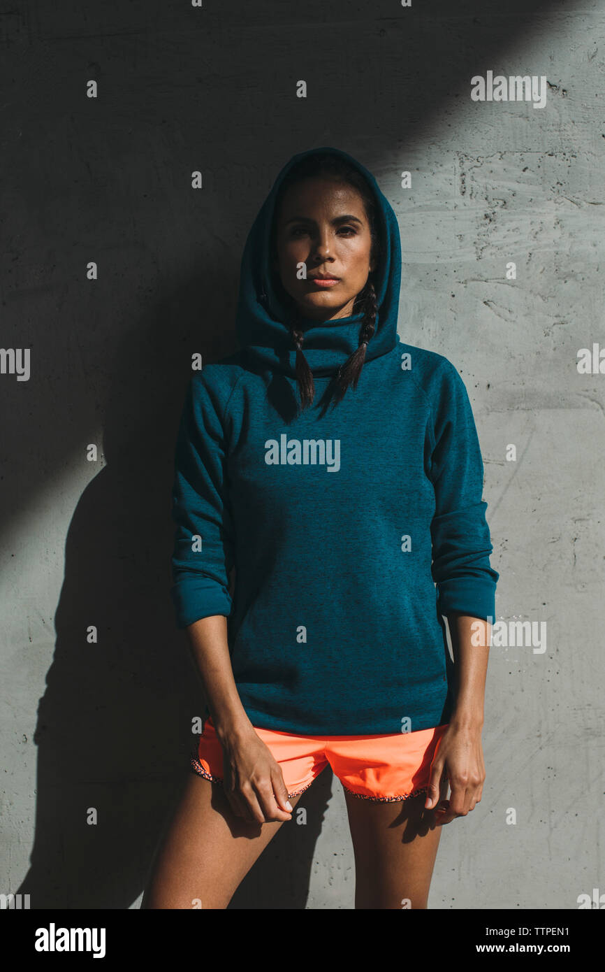 Portrait female athlete standing wall hi-res stock photography and ...
