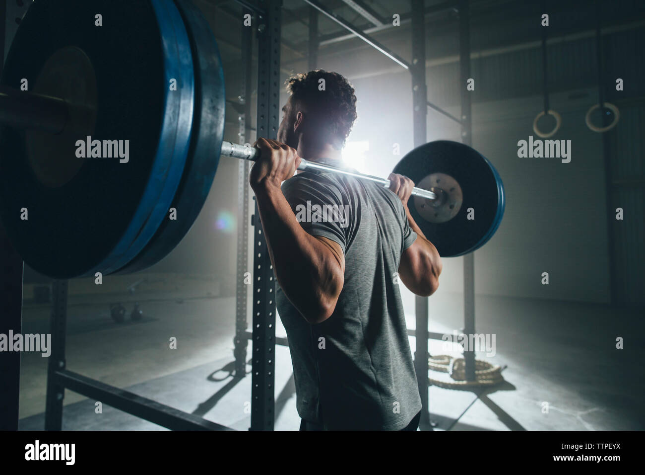 Side view man lifting barbell hi-res stock photography and images - Alamy