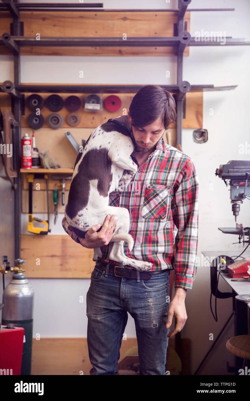 Man carrying dog hi-res stock photography and images - Alamy