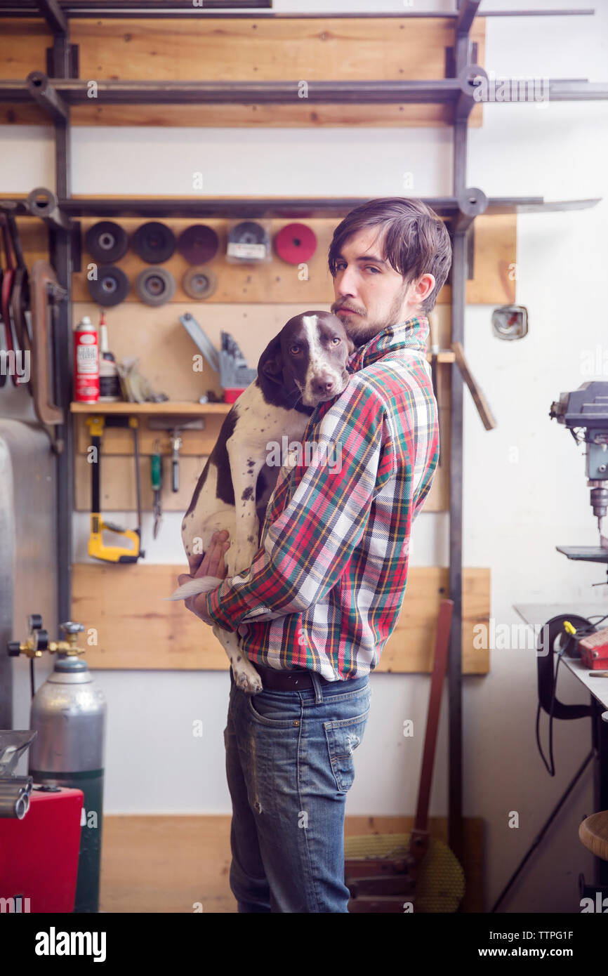 Man carrying dog hi-res stock photography and images - Alamy