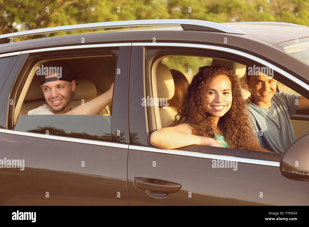Friends in a car Stock Photo - Alamy