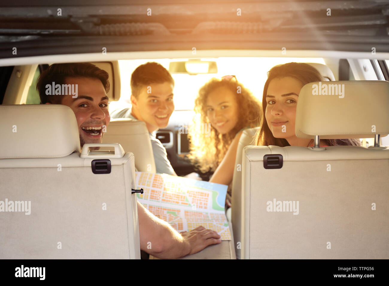 Friends in a car Stock Photo - Alamy