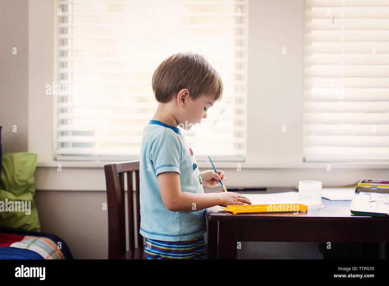 Boy writing book hi-res stock photography and images - Alamy