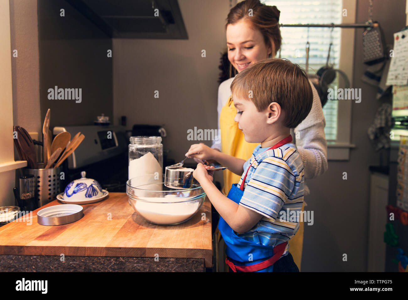 Mother and son baking in kitchen Stock Photo - Alamy