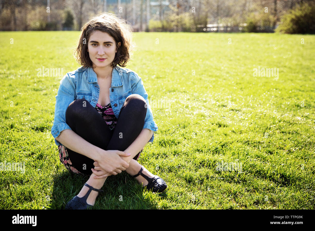 Female hugging knees hi-res stock photography and images - Alamy