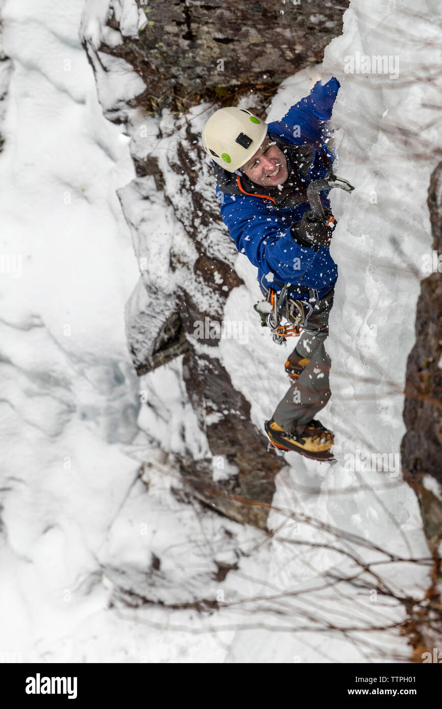 High angle view of hiker ice climbing at White Mountains Stock Photo ...