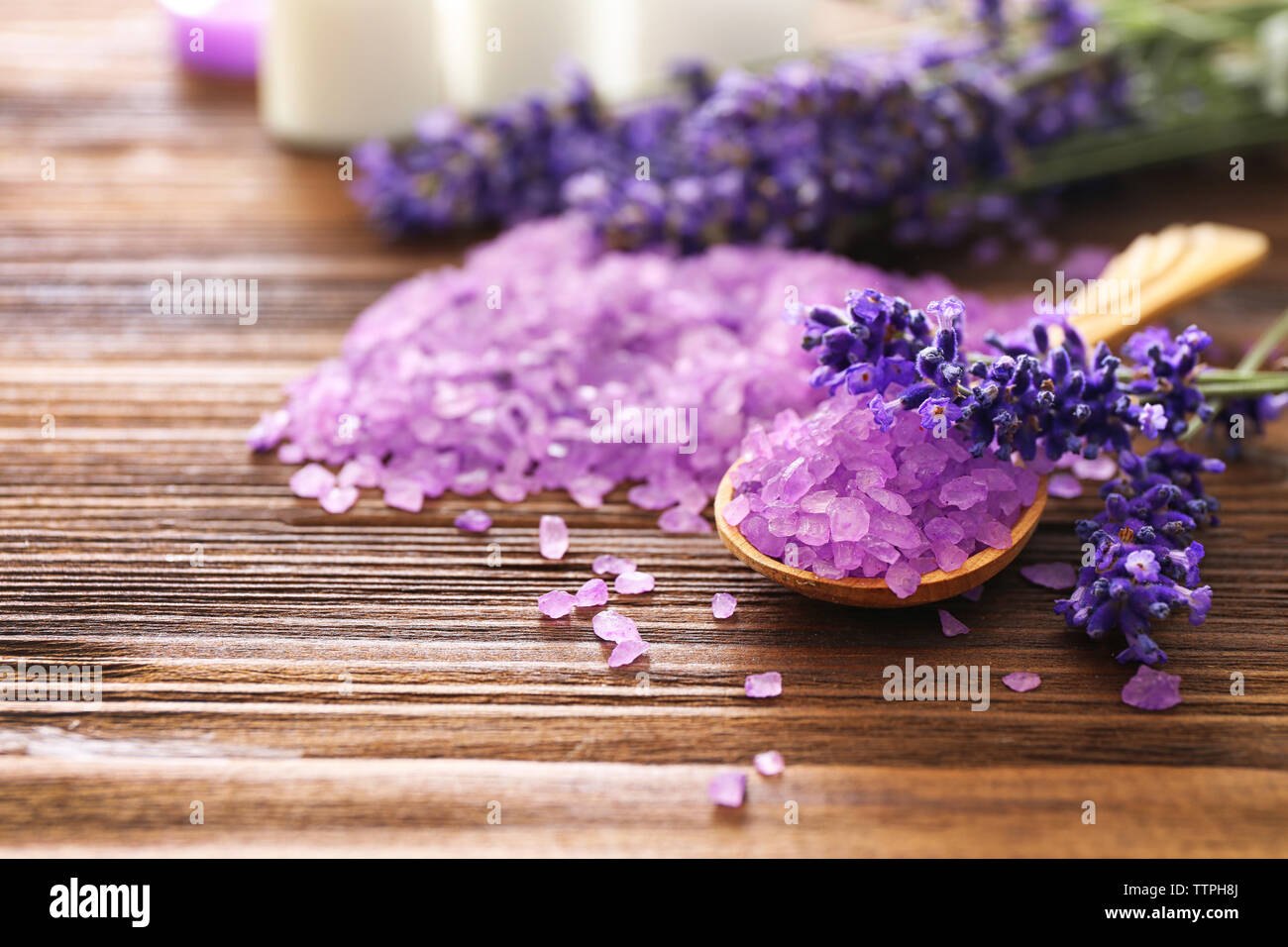 Purple sea salt with lavender on wooden background Stock Photo - Alamy