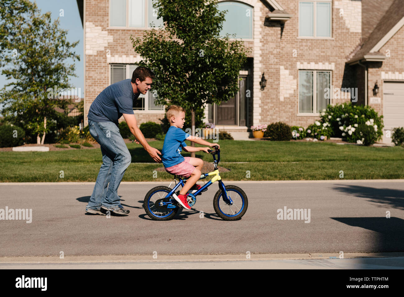 Side view caucasian father teaching hi-res stock photography and images ...