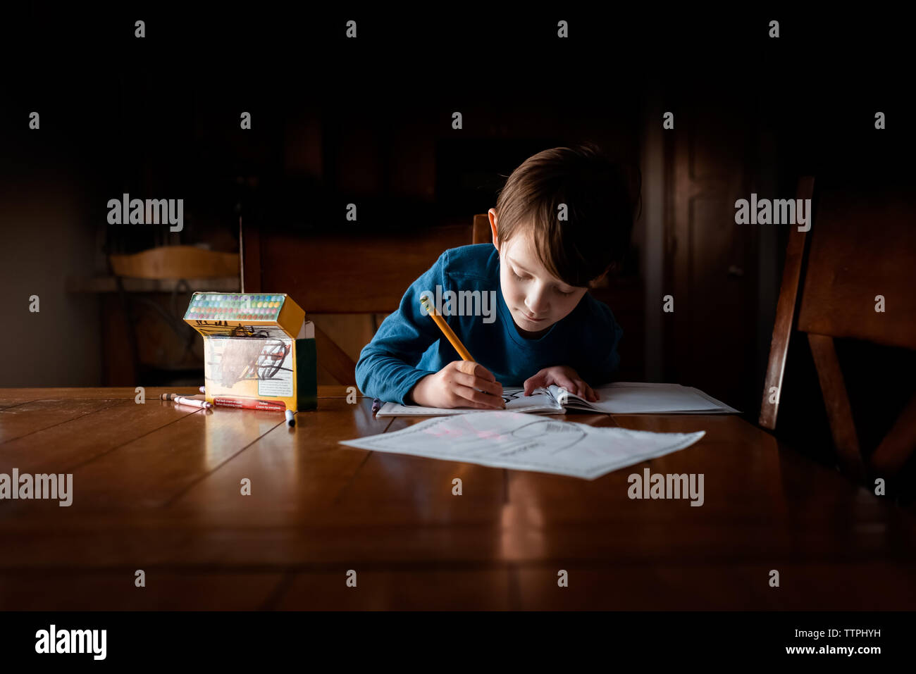 Kids doing homework table hi-res stock photography and images - Alamy