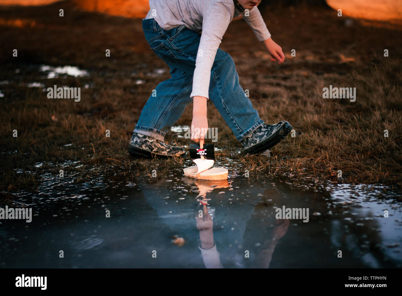 Kids playing in puddle hi-res stock photography and images - Alamy