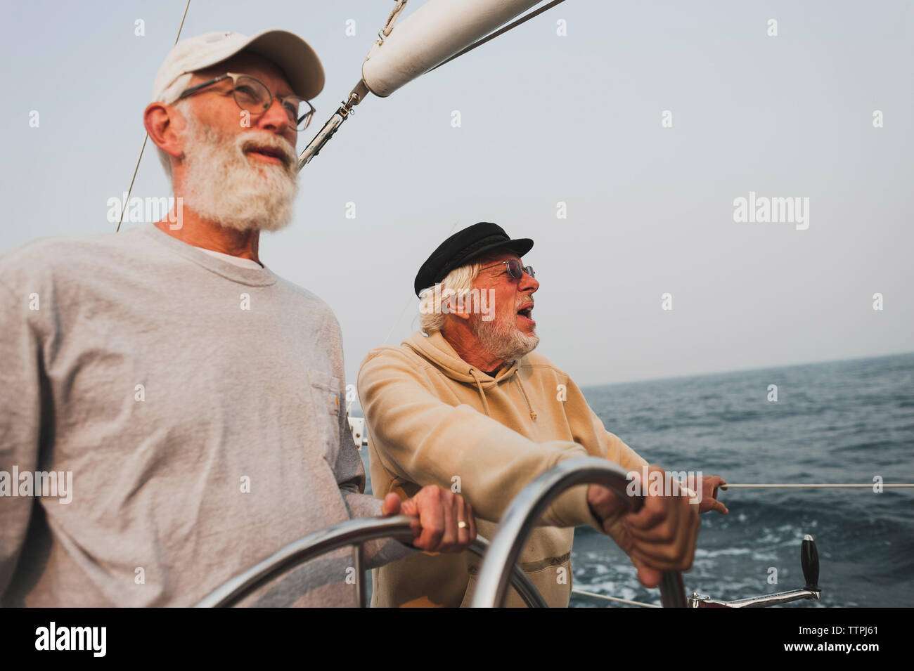 Two men together on sailboat hi-res stock photography and images - Alamy