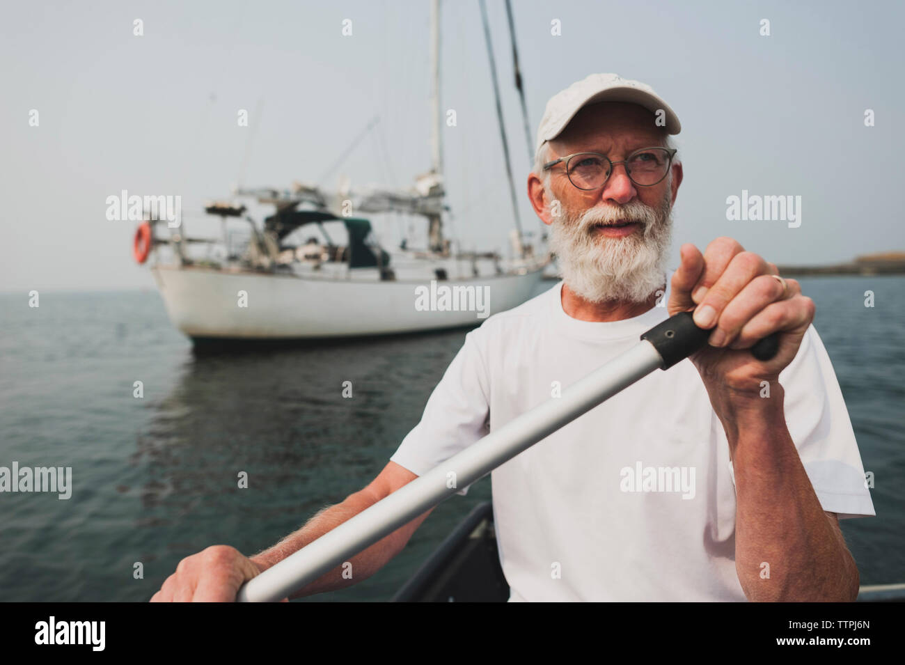 Man rowing sea hi-res stock photography and images - Alamy