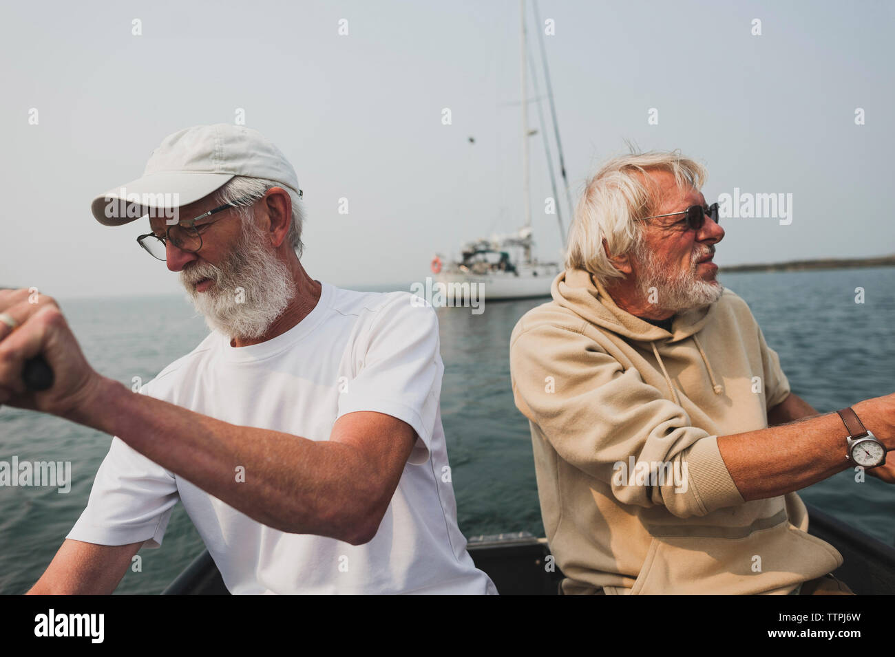 Two men together on sailboat hi-res stock photography and images - Alamy