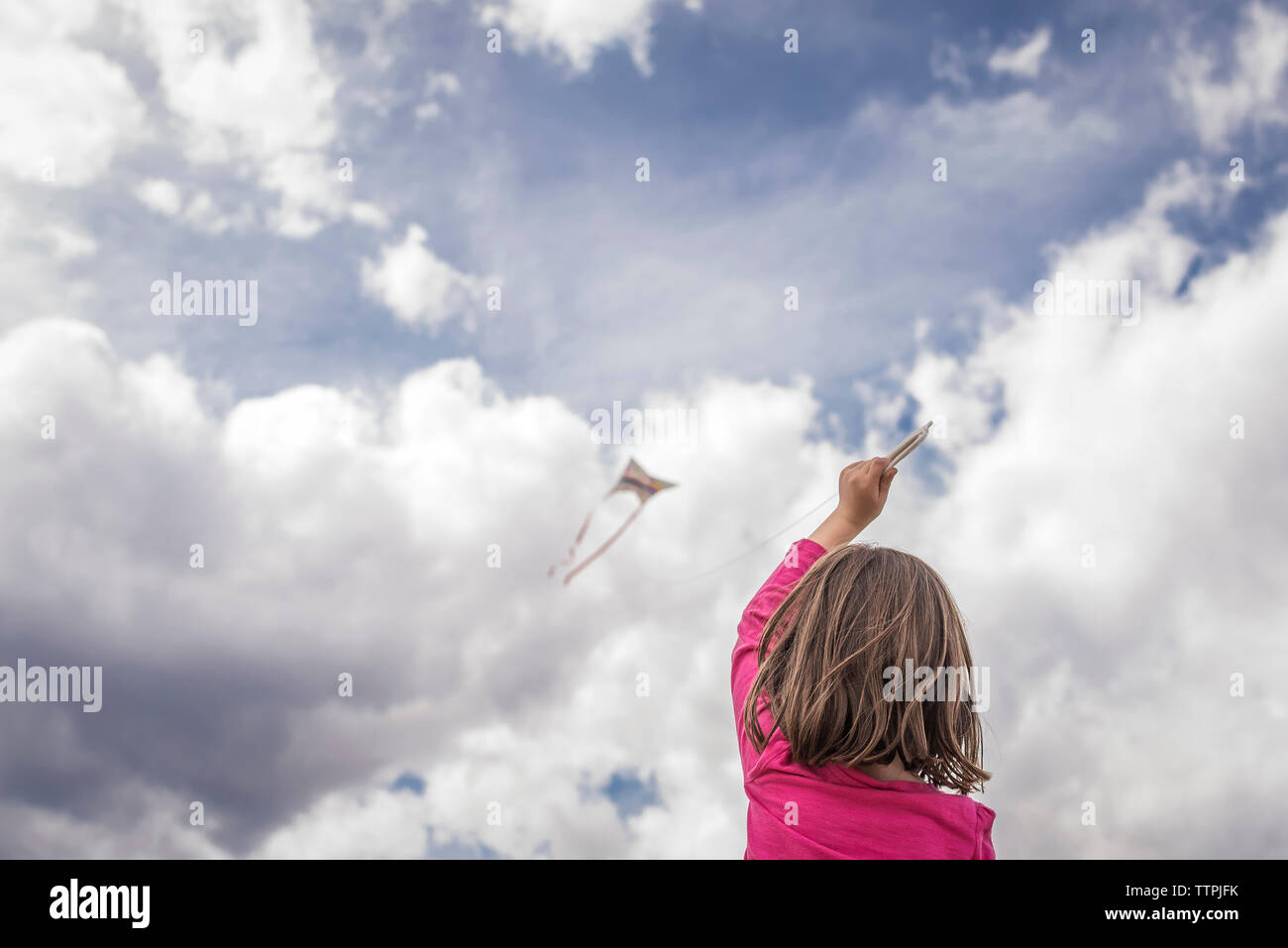 Girl, flying, kite hi-res stock photography and images - Alamy