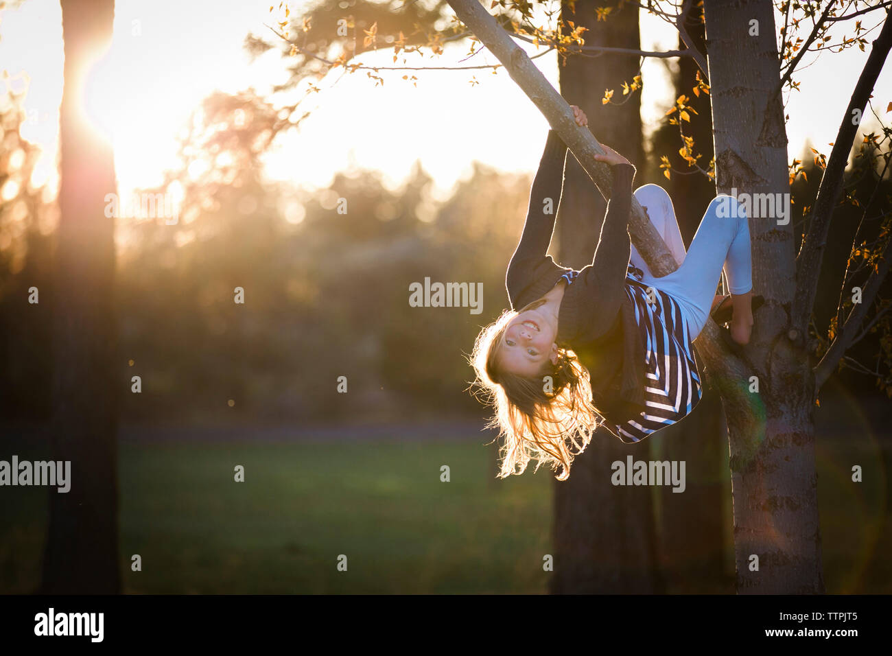 Girl hanging upside down on hi-res stock photography and images - Alamy