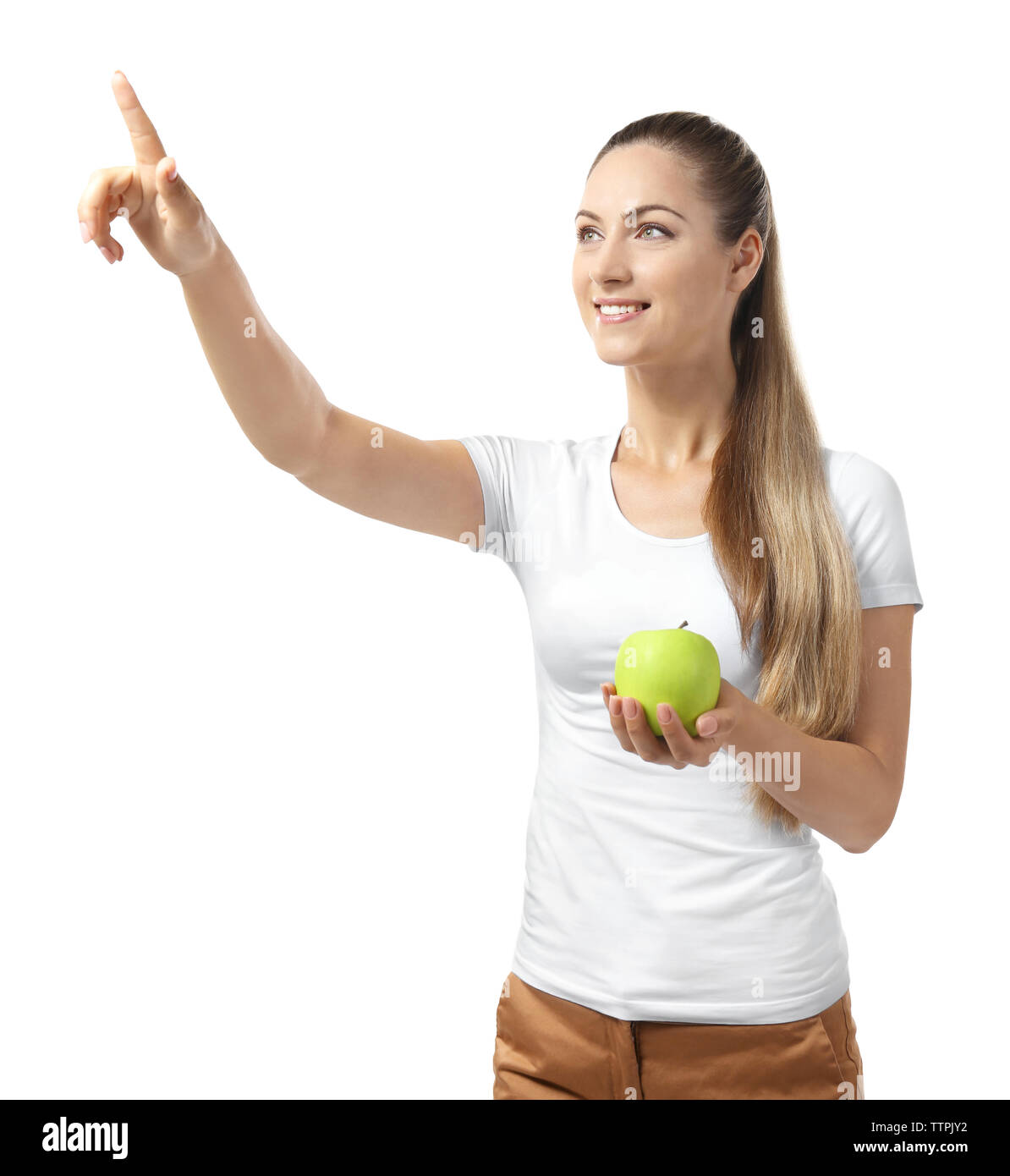Beautiful girl with apple pointing finger, isolated on white Stock ...