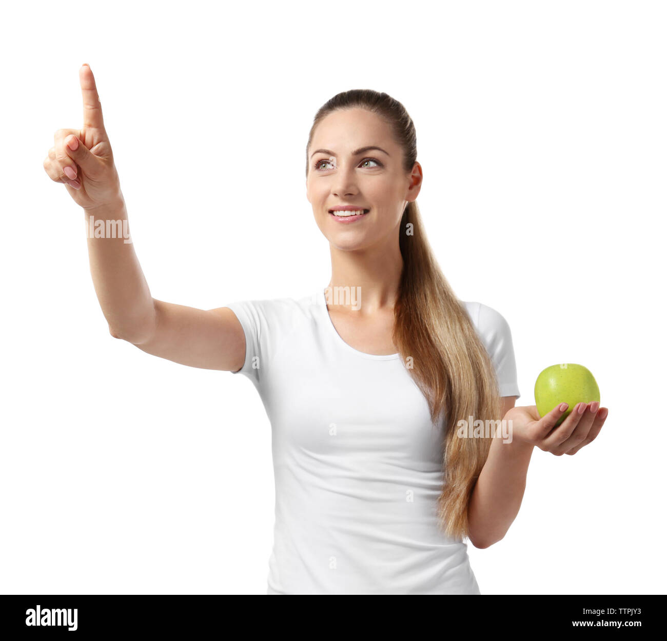 Beautiful girl with apple pointing finger, isolated on white Stock ...
