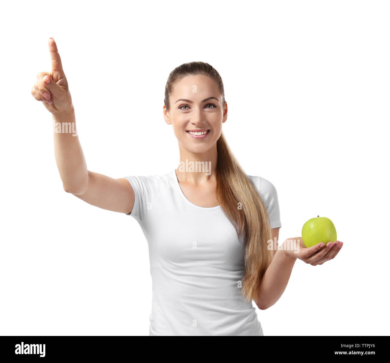 Beautiful girl with apple pointing finger, isolated on white Stock ...