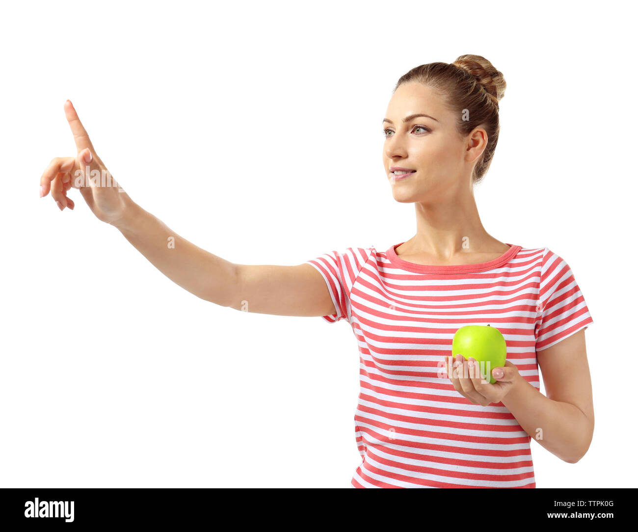 Beautiful girl with apple pointing finger, isolated on white Stock ...