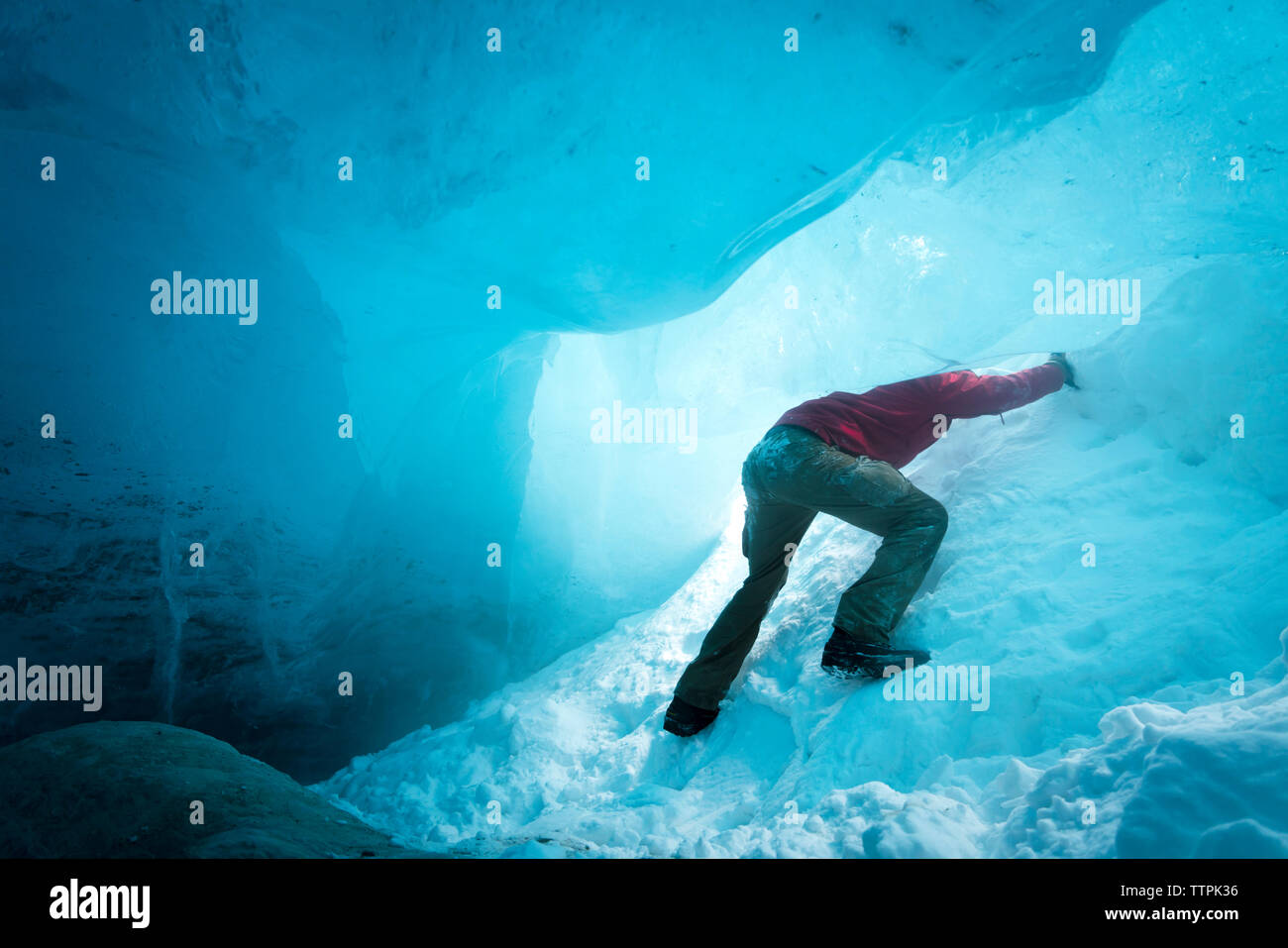 Hiker in ice cave hi-res stock photography and images - Alamy