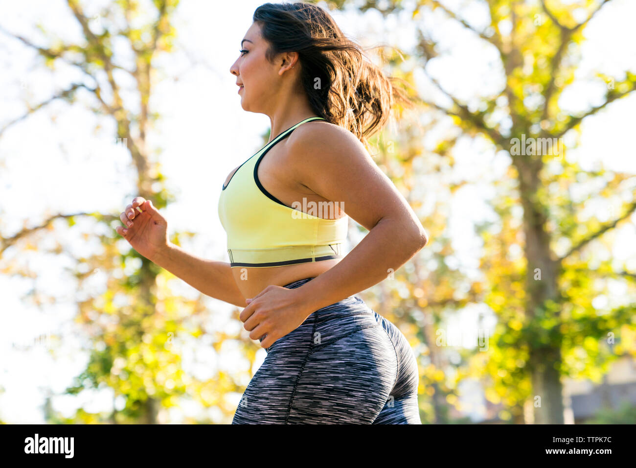 Woman jogging in park hi-res stock photography and images - Alamy