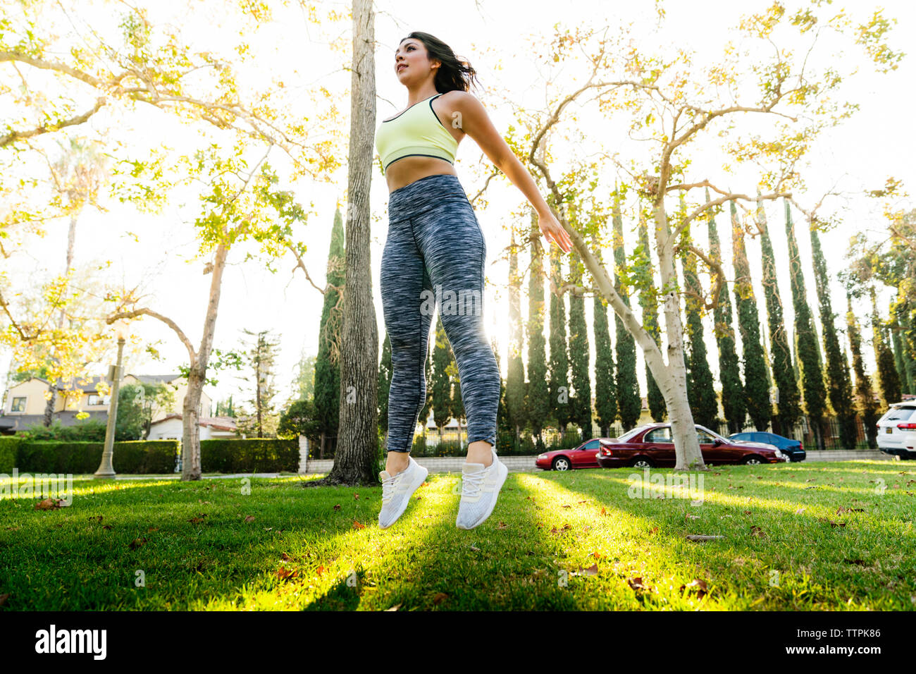 Healthy woman jumping hi-res stock photography and images - Alamy
