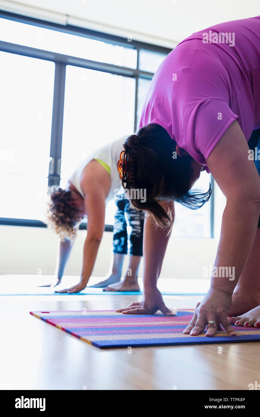 Two mature women bending over hi-res stock photography and images - Alamy