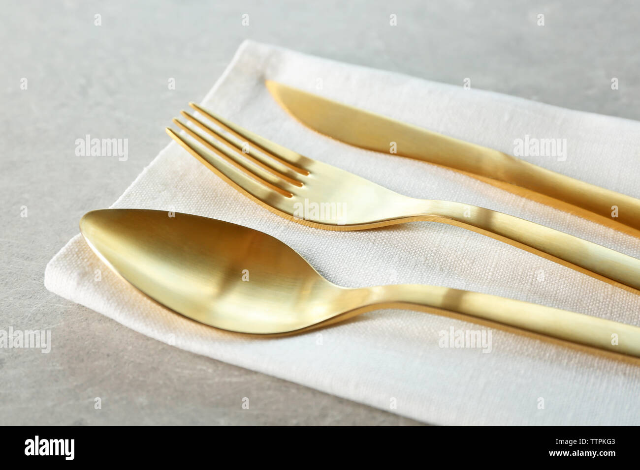 Table setting with cutlery and napkin, closeup Stock Photo - Alamy