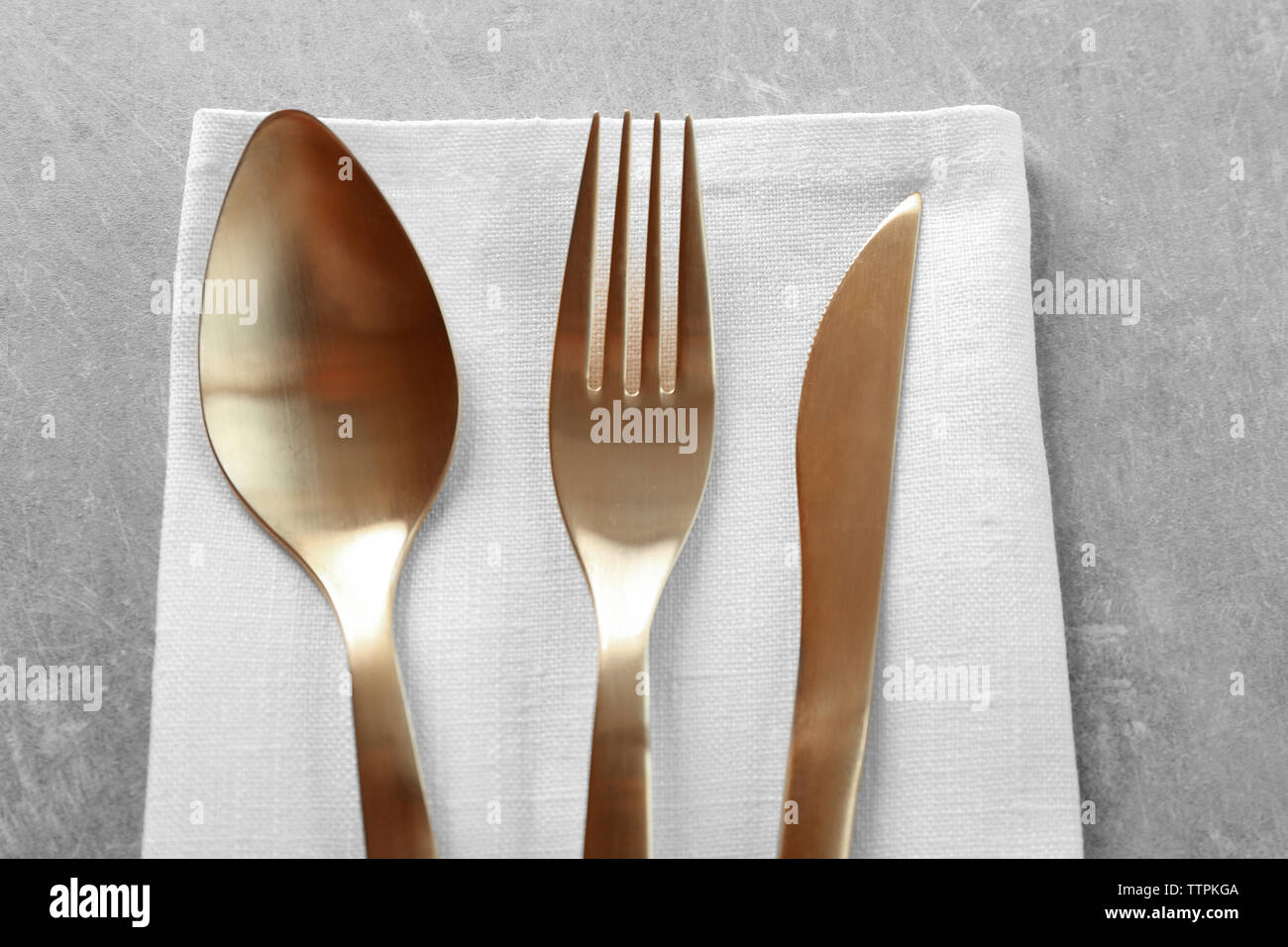 Table setting with cutlery and napkin, closeup Stock Photo - Alamy