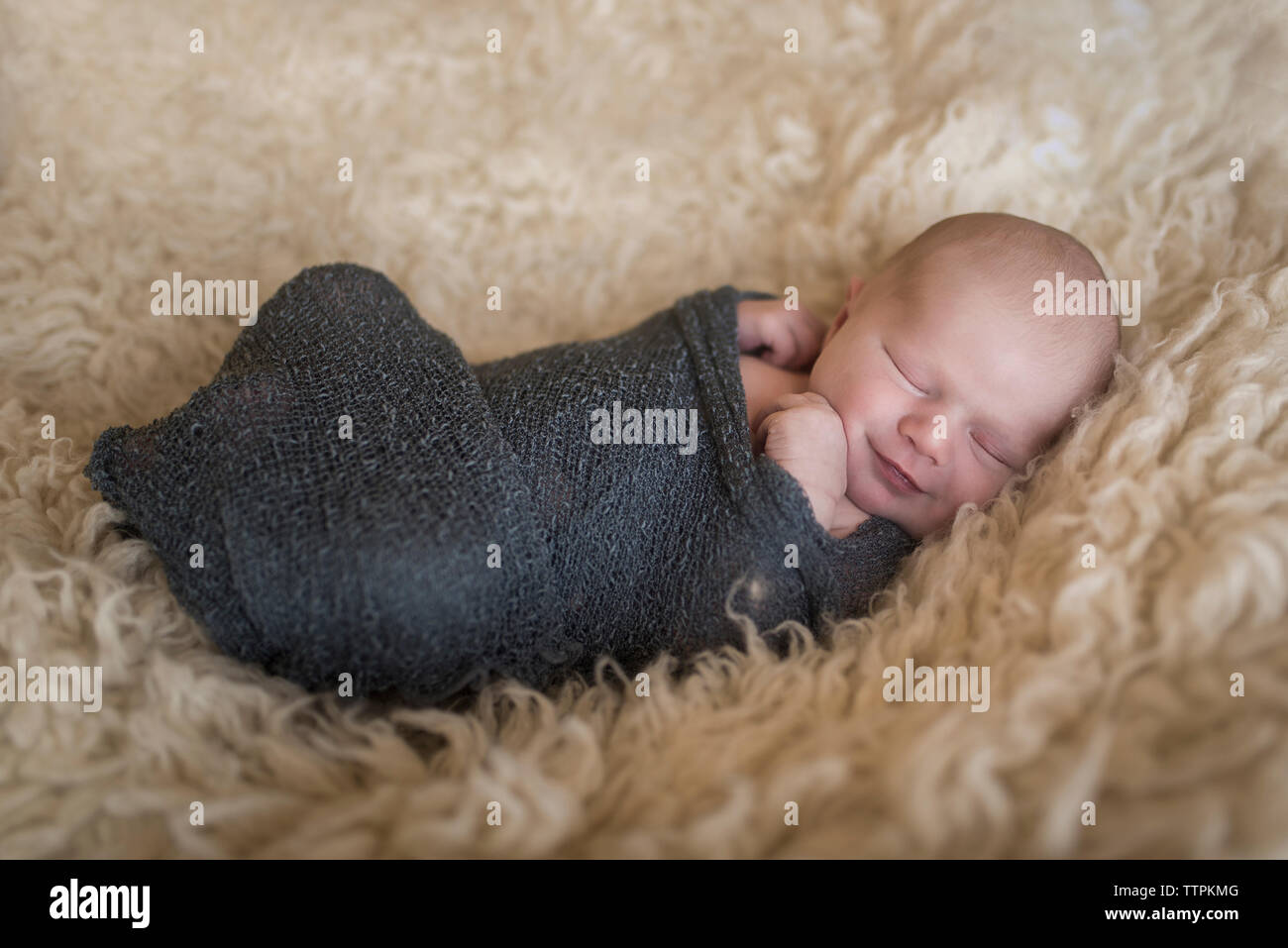 Baby boy lying on rug hi-res stock photography and images - Alamy