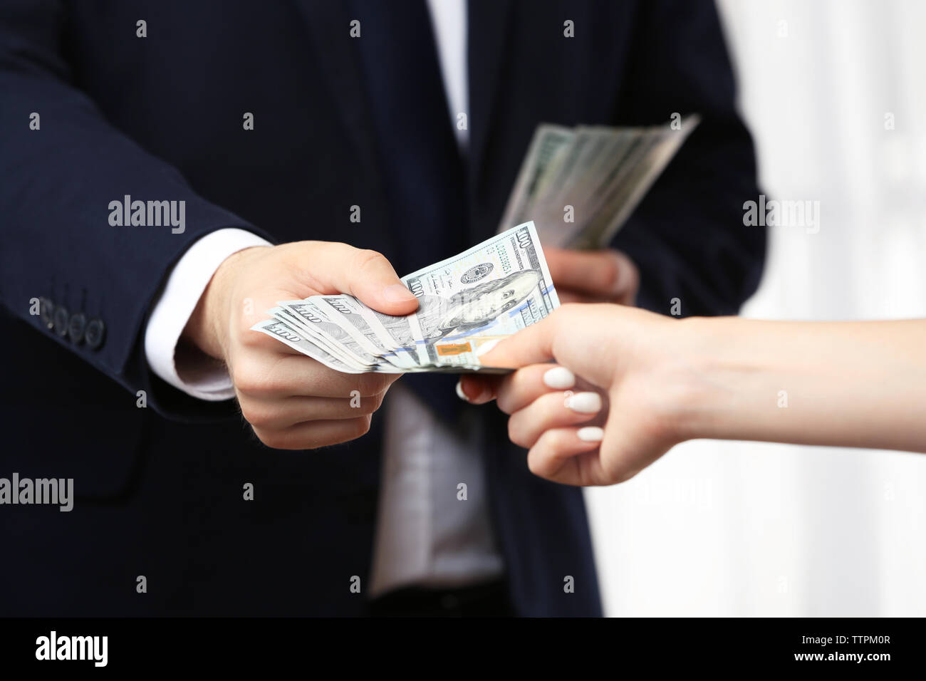 Closeup man hand put banknote hi-res stock photography and images - Alamy