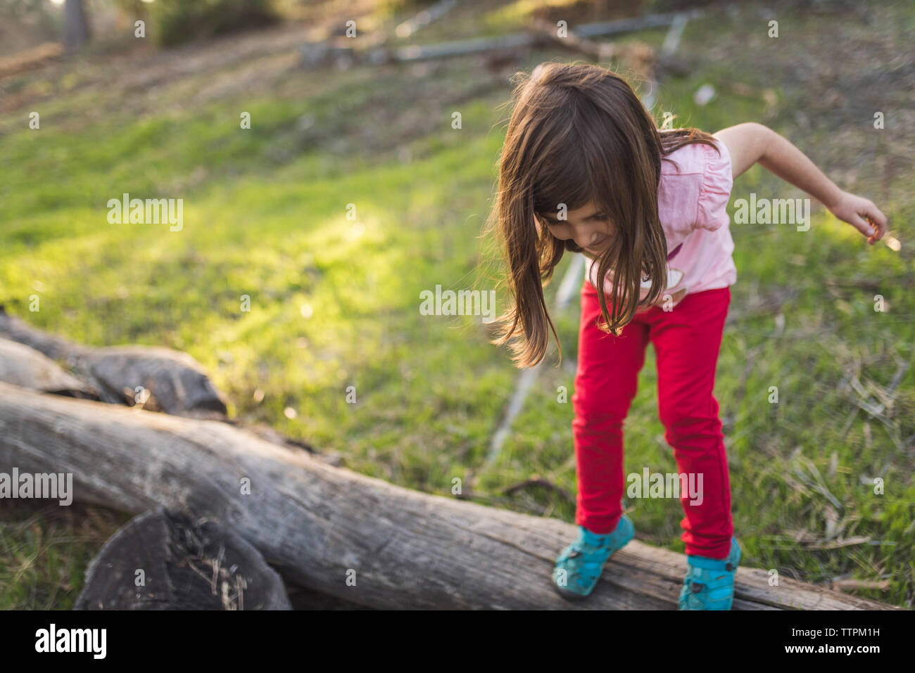 Girl on log hi-res stock photography and images - Alamy