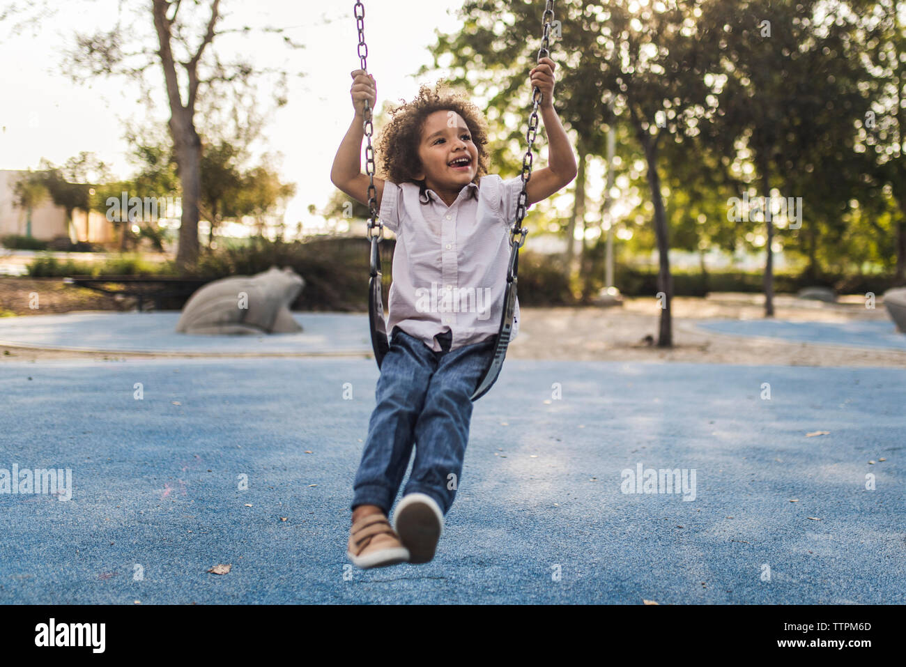 Happy boy swing boy happy swing hi-res stock photography and images - Alamy
