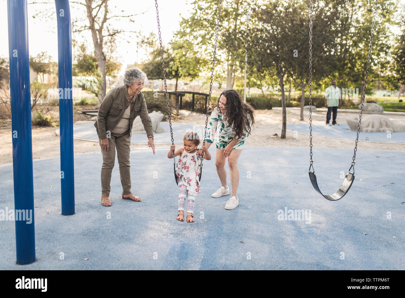 Family enjoying at playground Stock Photo - Alamy