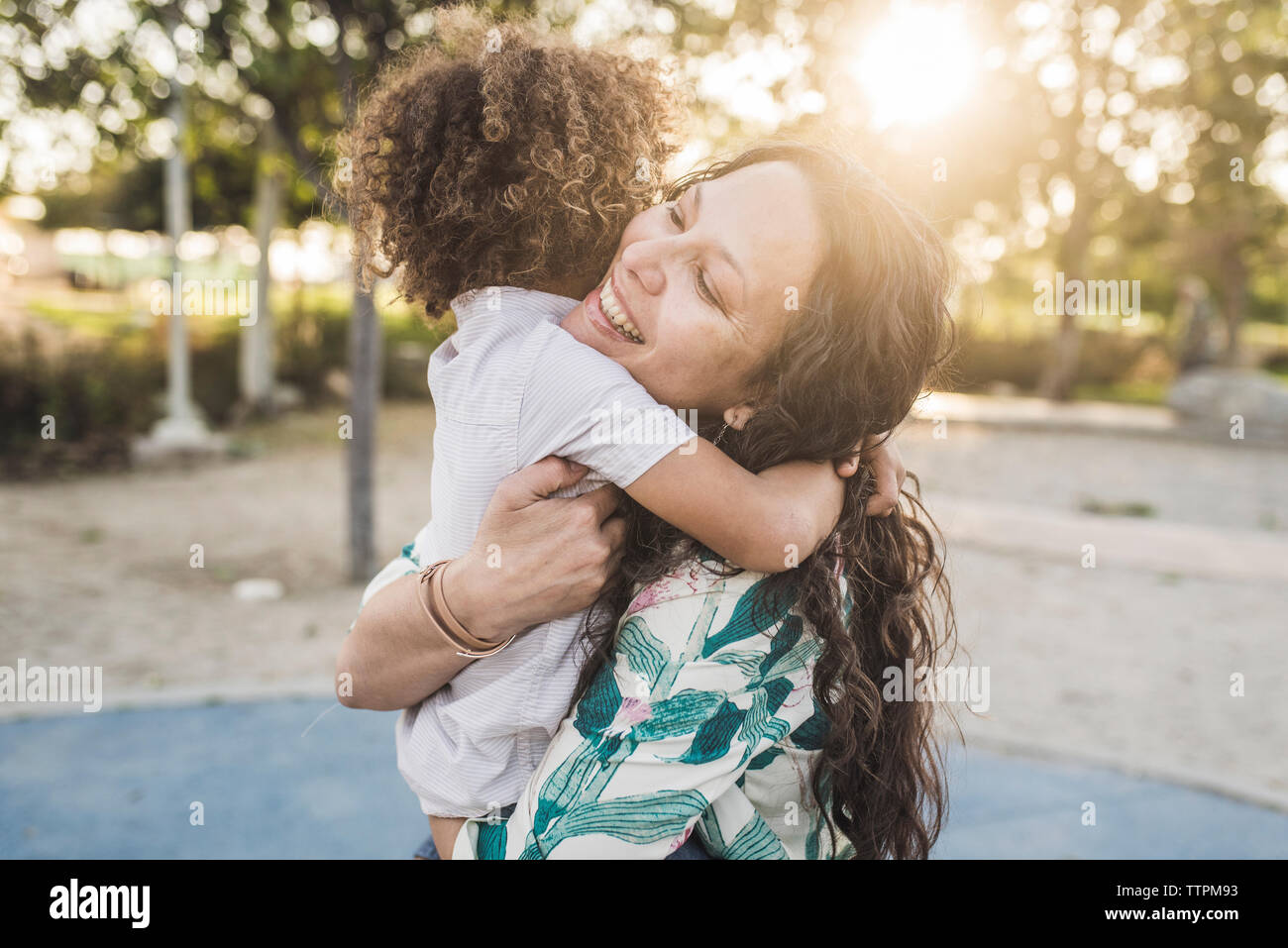 Arms around smiling childhood fun hi-res stock photography and images ...