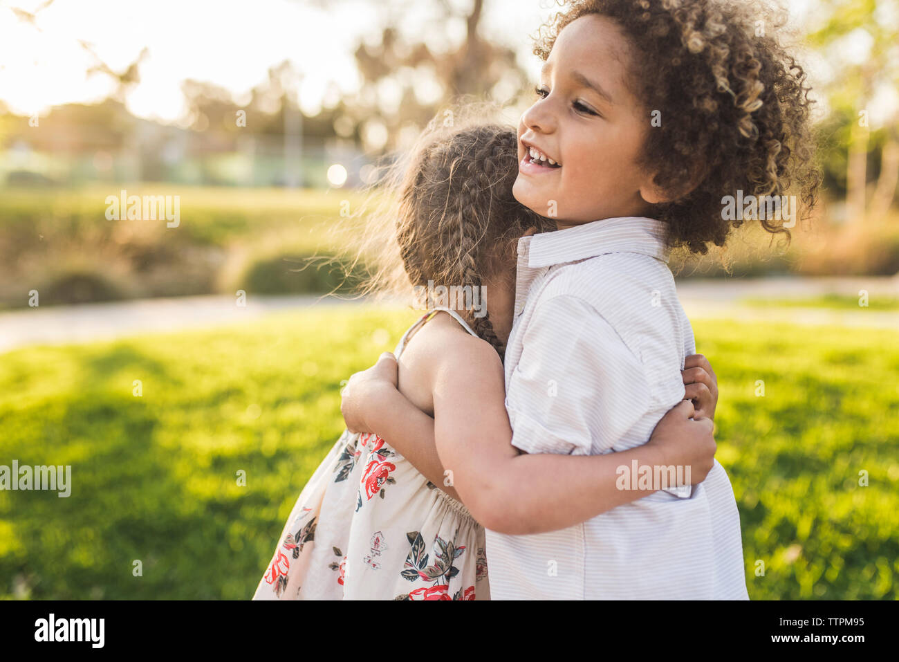 Cute siblings arms around hi-res stock photography and images - Alamy