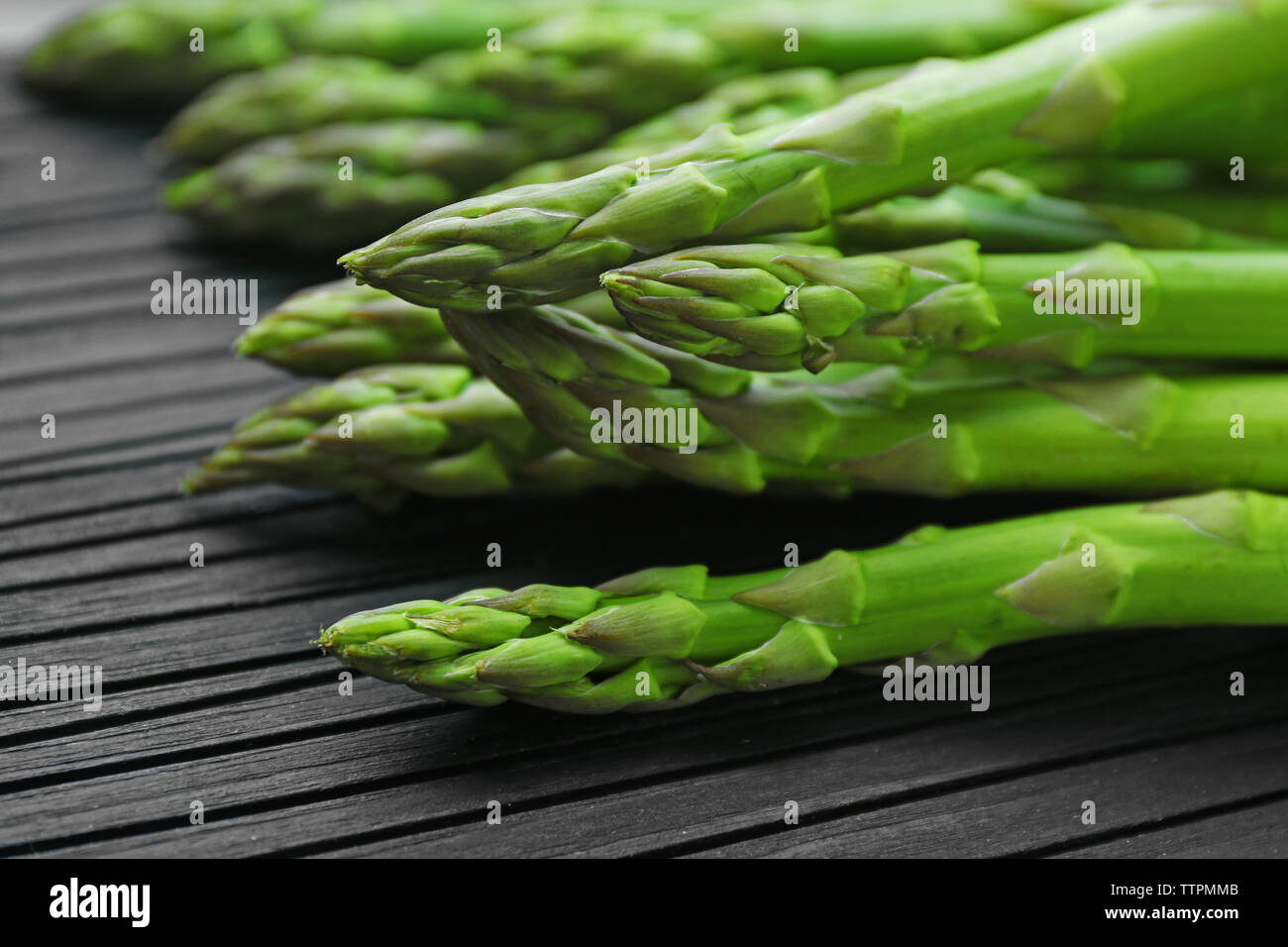 Fresh asparagus on table, closeup Stock Photo - Alamy
