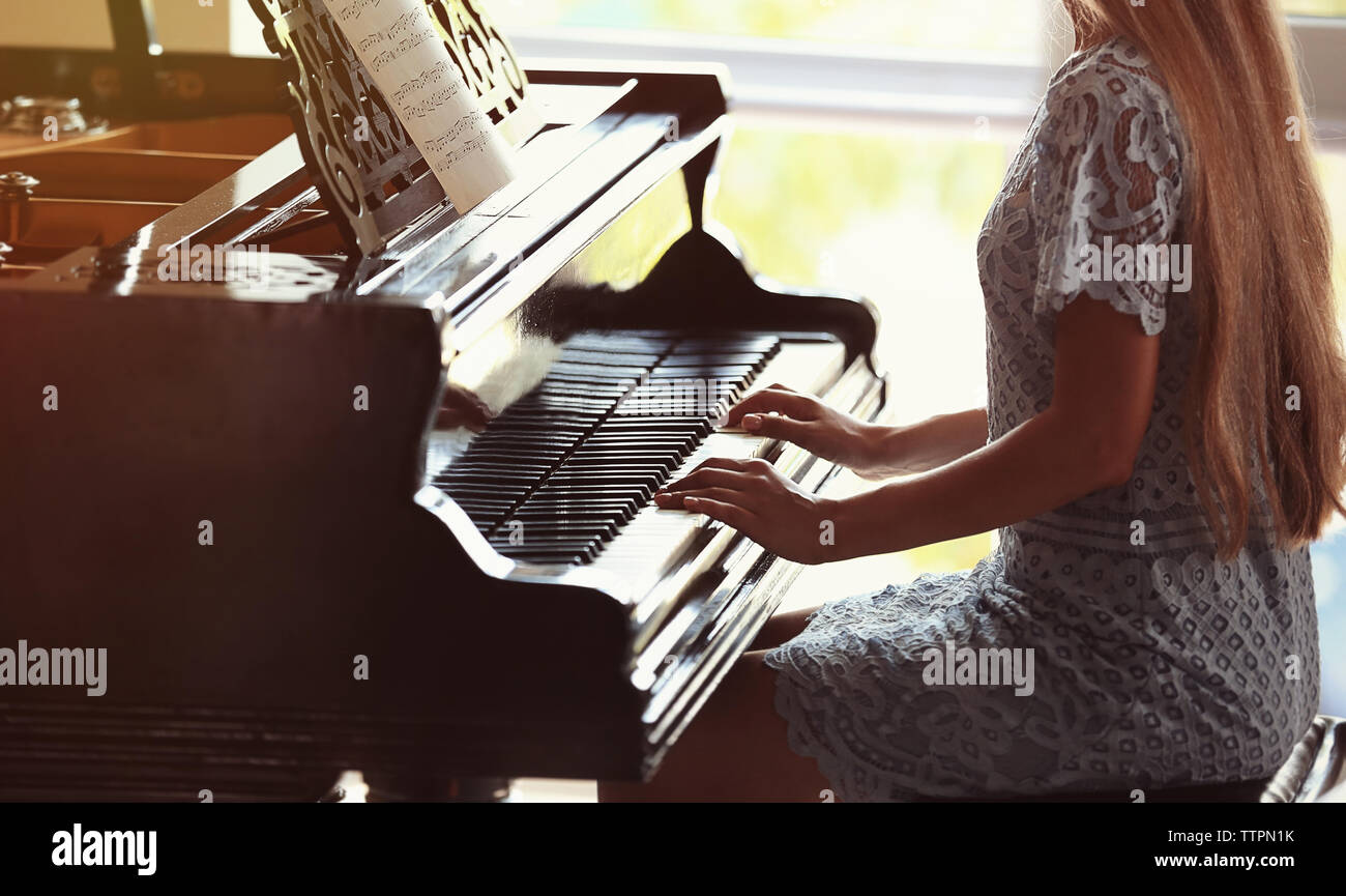 Playing piano hi-res stock photography and images - Alamy