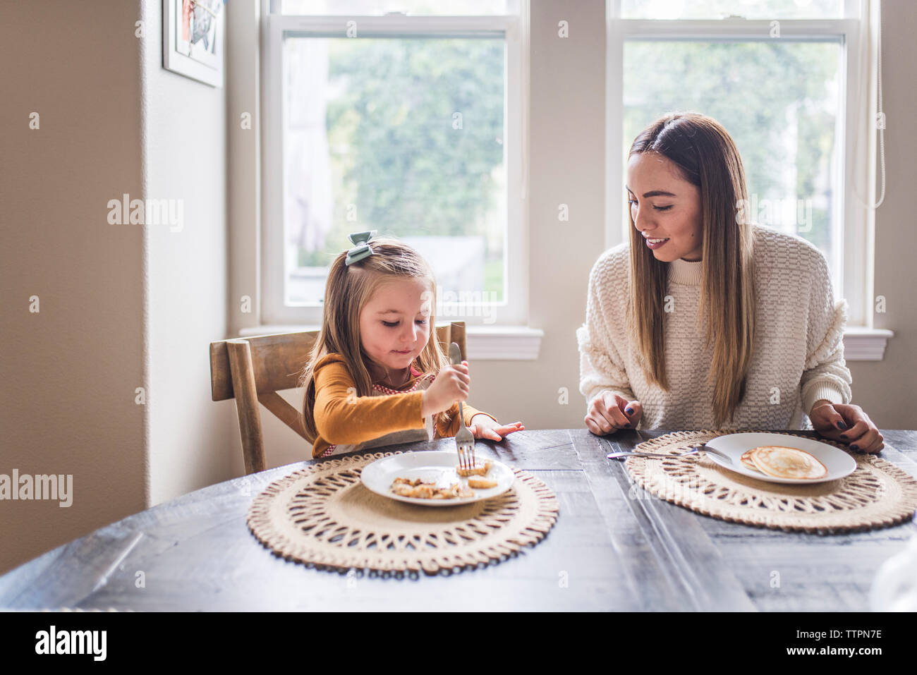Multigenerational family eating pancakes for breakfast Stock Photo - Alamy