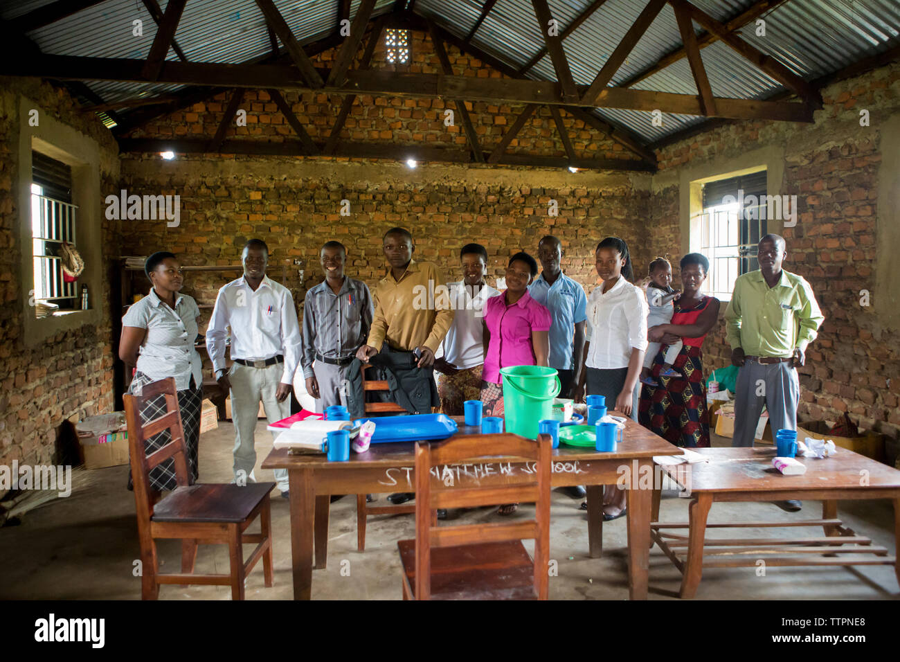 Teachers standing by table in staffroom Stock Photo - Alamy