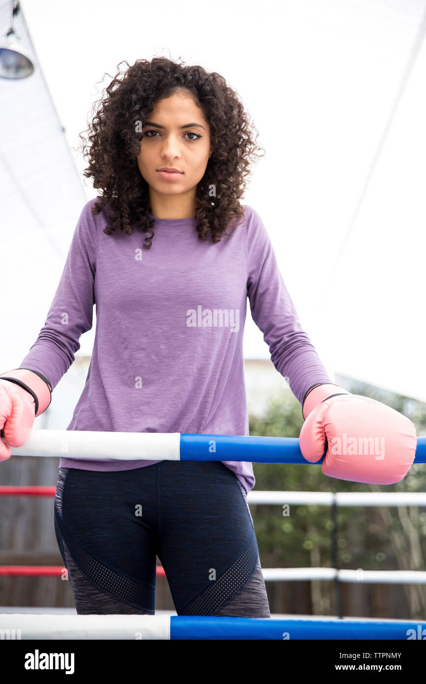 Portrait of female boxer standing in boxing ring Stock Photo - Alamy
