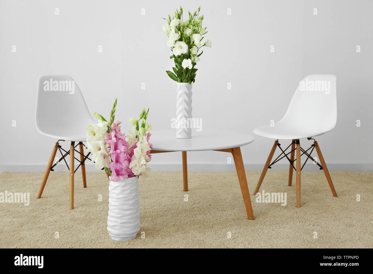 Interior with furniture and decorative flowers Stock Photo - Alamy