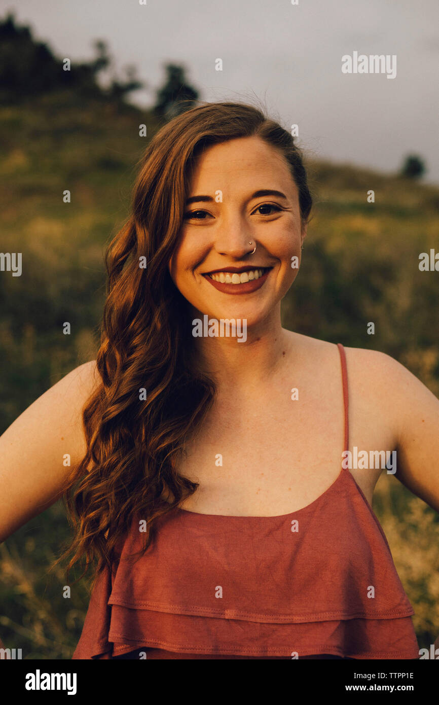 Cheerful young caucasian woman standing hi-res stock photography and ...