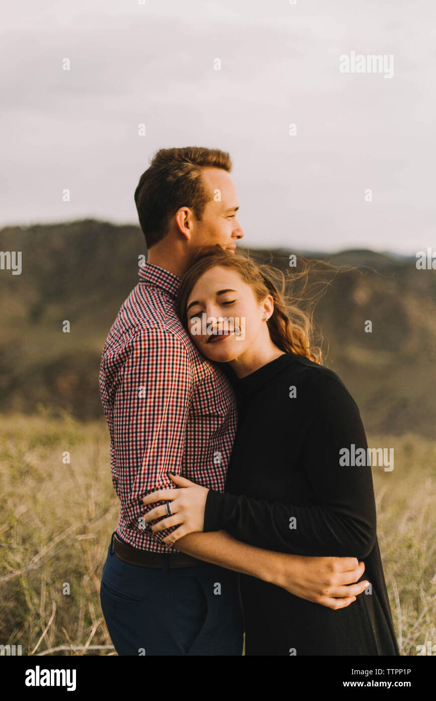 Young woman embracing nature hi-res stock photography and images - Alamy