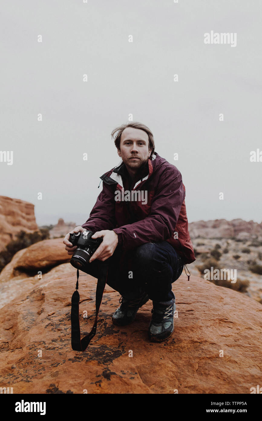 Crouching looking to camera hi-res stock photography and images - Alamy