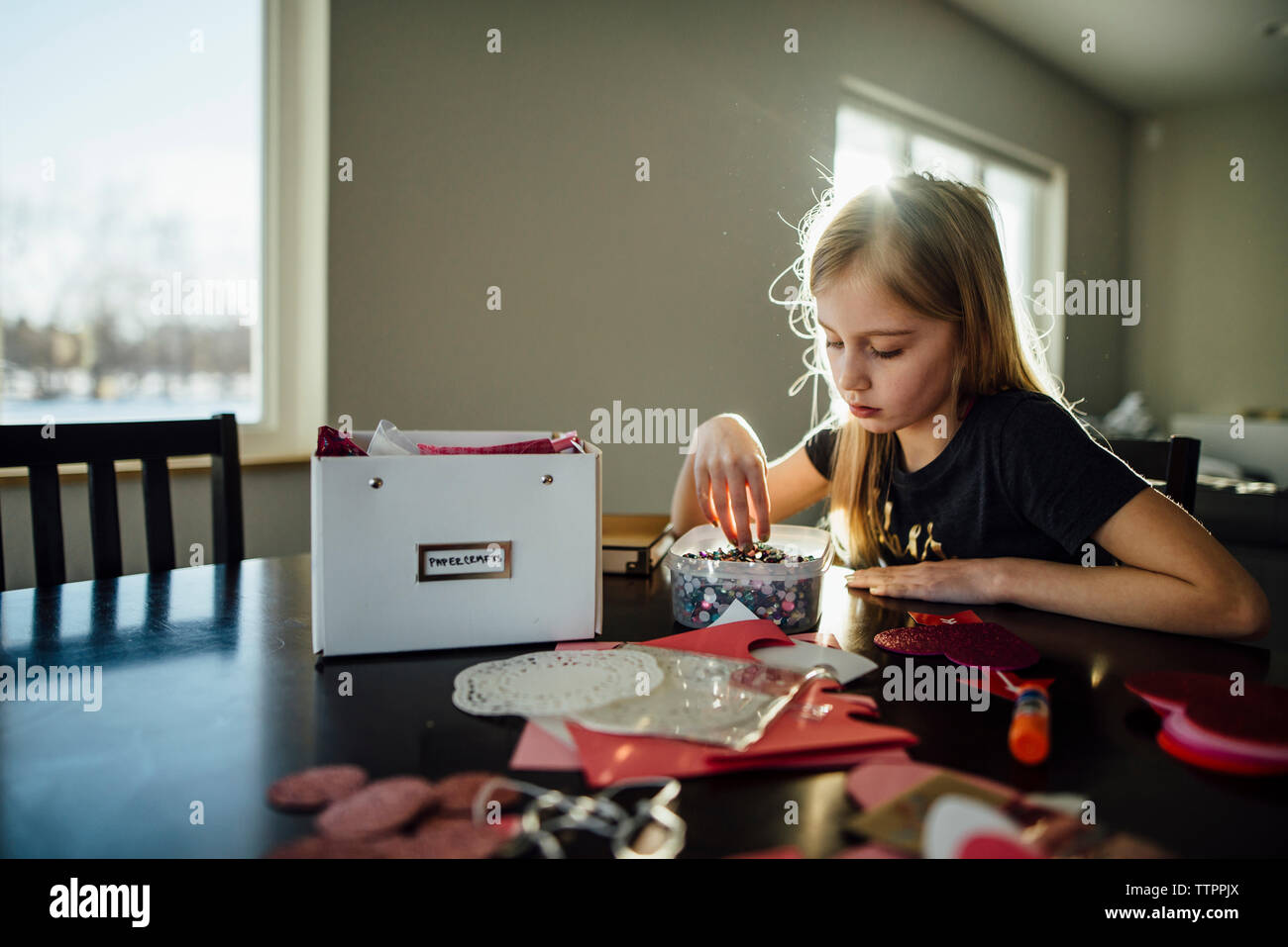Girl preparing artwork sitting hi-res stock photography and images - Alamy