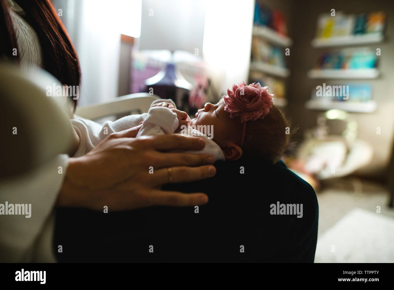 Mother carrying sleeping daughter hi-res stock photography and images ...