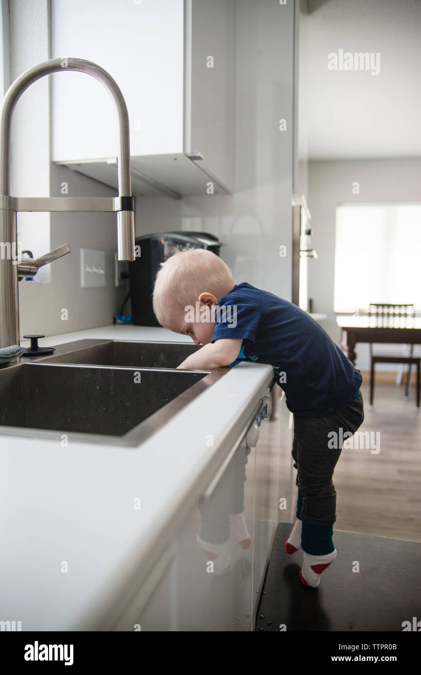 Boy in sink hi-res stock photography and images - Alamy
