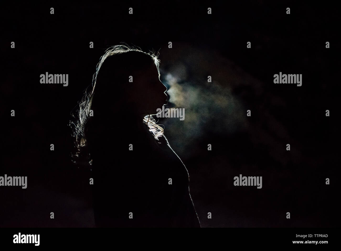 Blowing smoke hi-res stock photography and images - Alamy